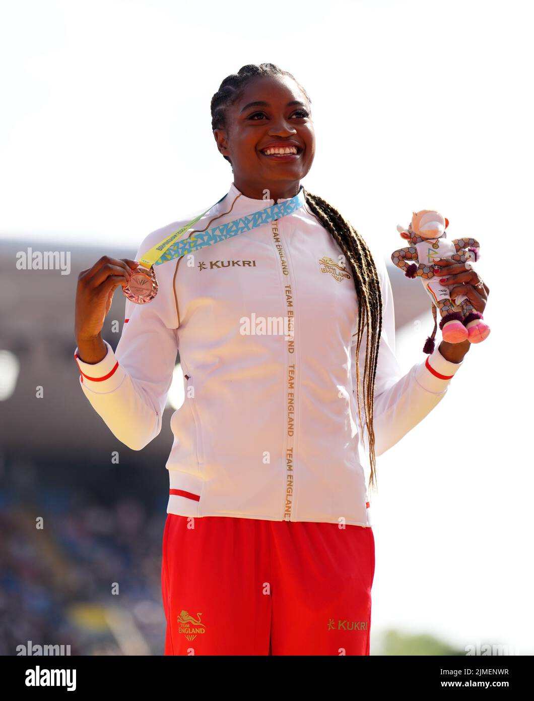 England's Naomi Metzger poses with her bronze medal after finishing ...