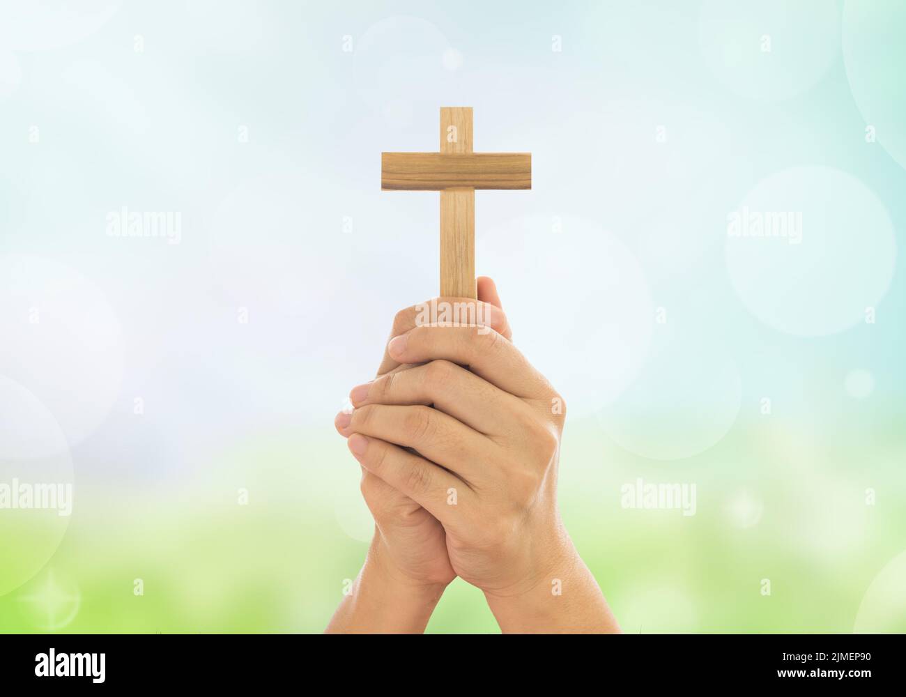 Human hands holding a cross holy and prayed for blessings from God ...