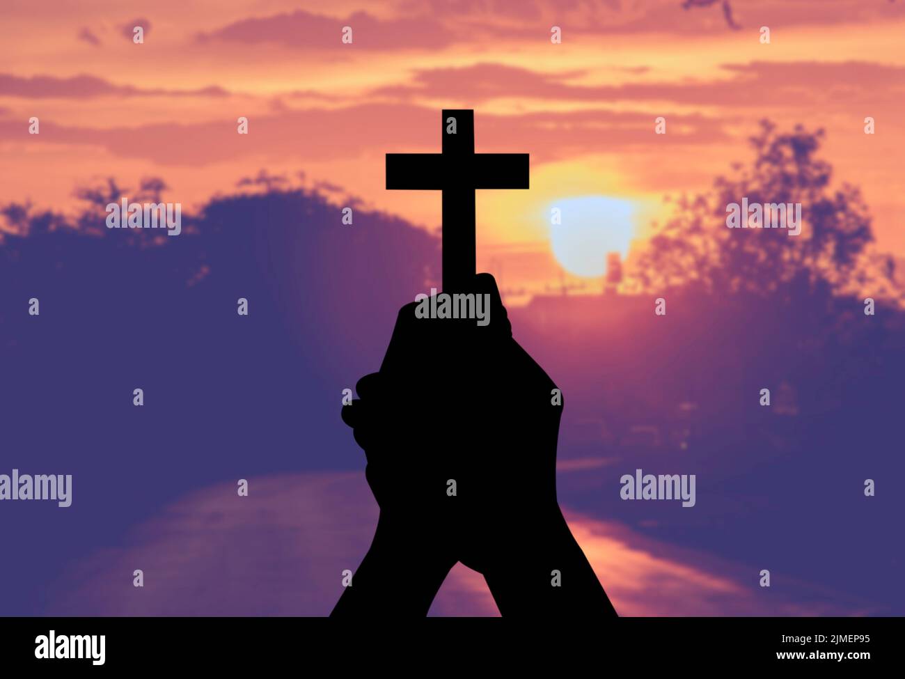 silhouette human hands holding a cross holy and prayed for blessings ...