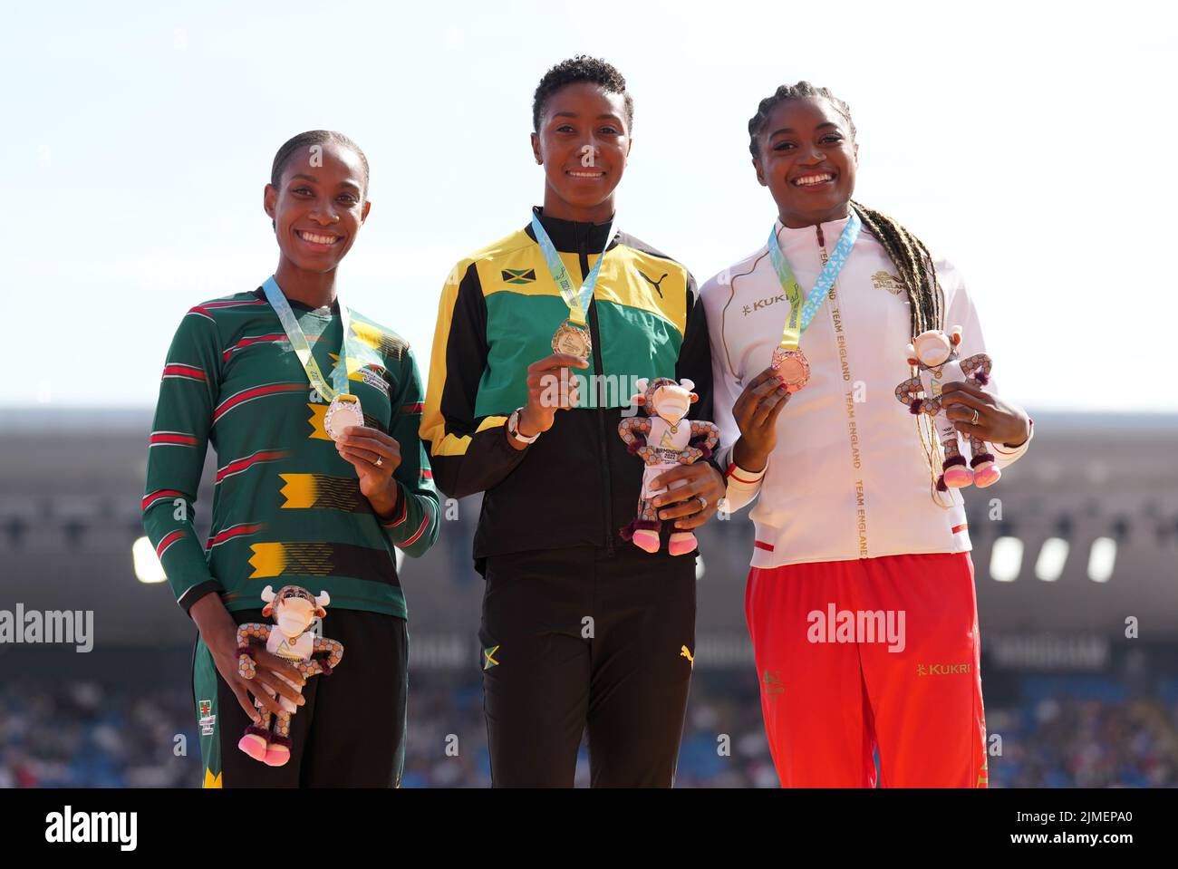 Jamaica's Shanieka Ricketts (centre) poses with her gold medal after ...
