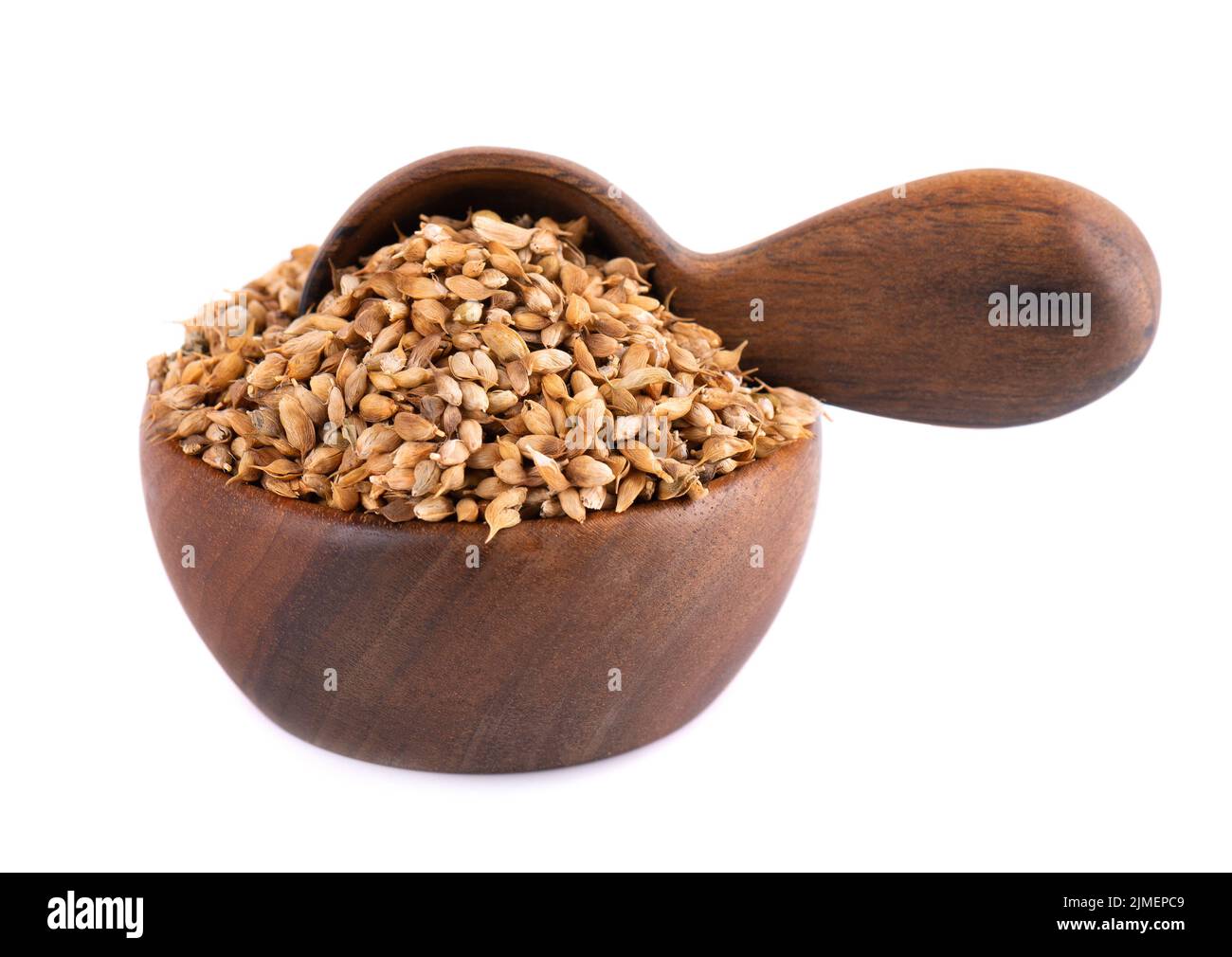 Utsho suneli seeds in wooden bowl and spoon, isolated on white ...
