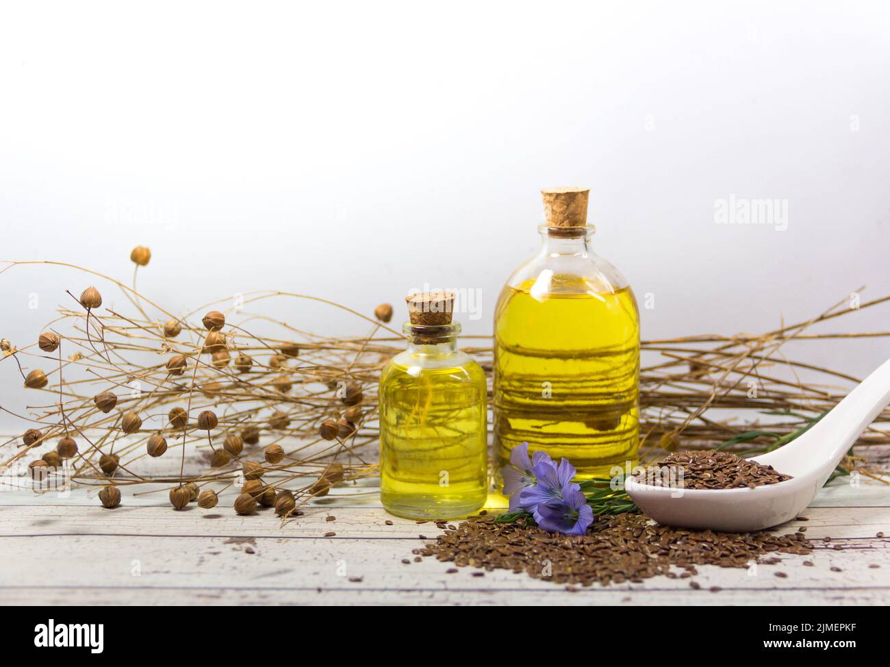 Bottles of linseed oil flowers and seeds Stock Photo - Alamy