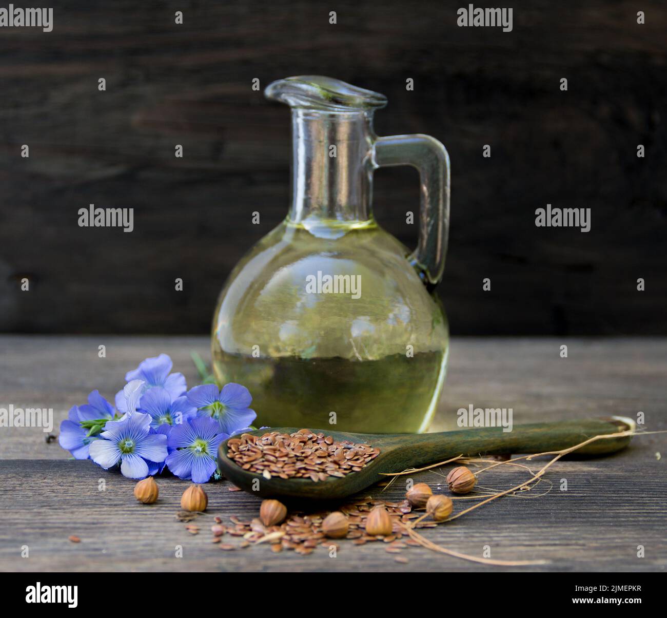 Bottle of flax oil with flowers and seeds Stock Photo - Alamy