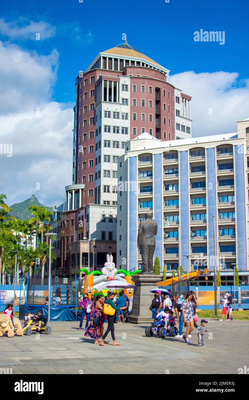 The vertical view of the colorful city buildings of Port Louis under ...