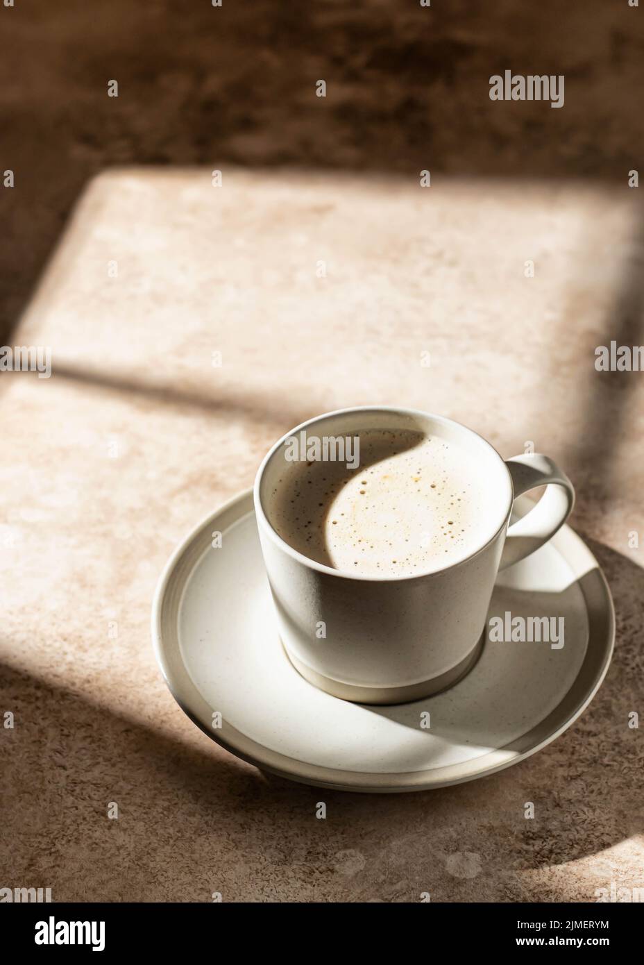 Cappuccino with foam in hard light with beautiful shadows isolated ...