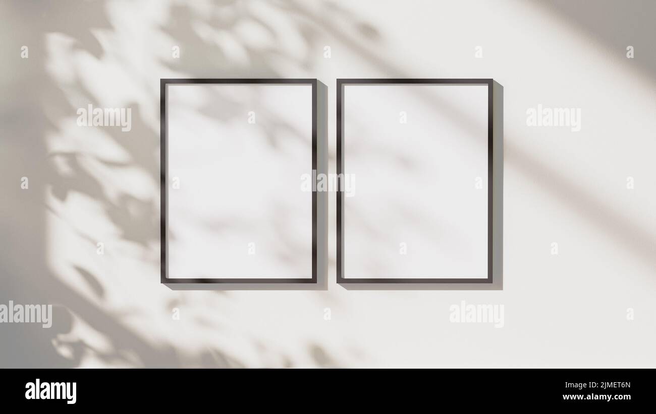 Blank black vertical frames mock up with leaves shadows and sunlight on ...