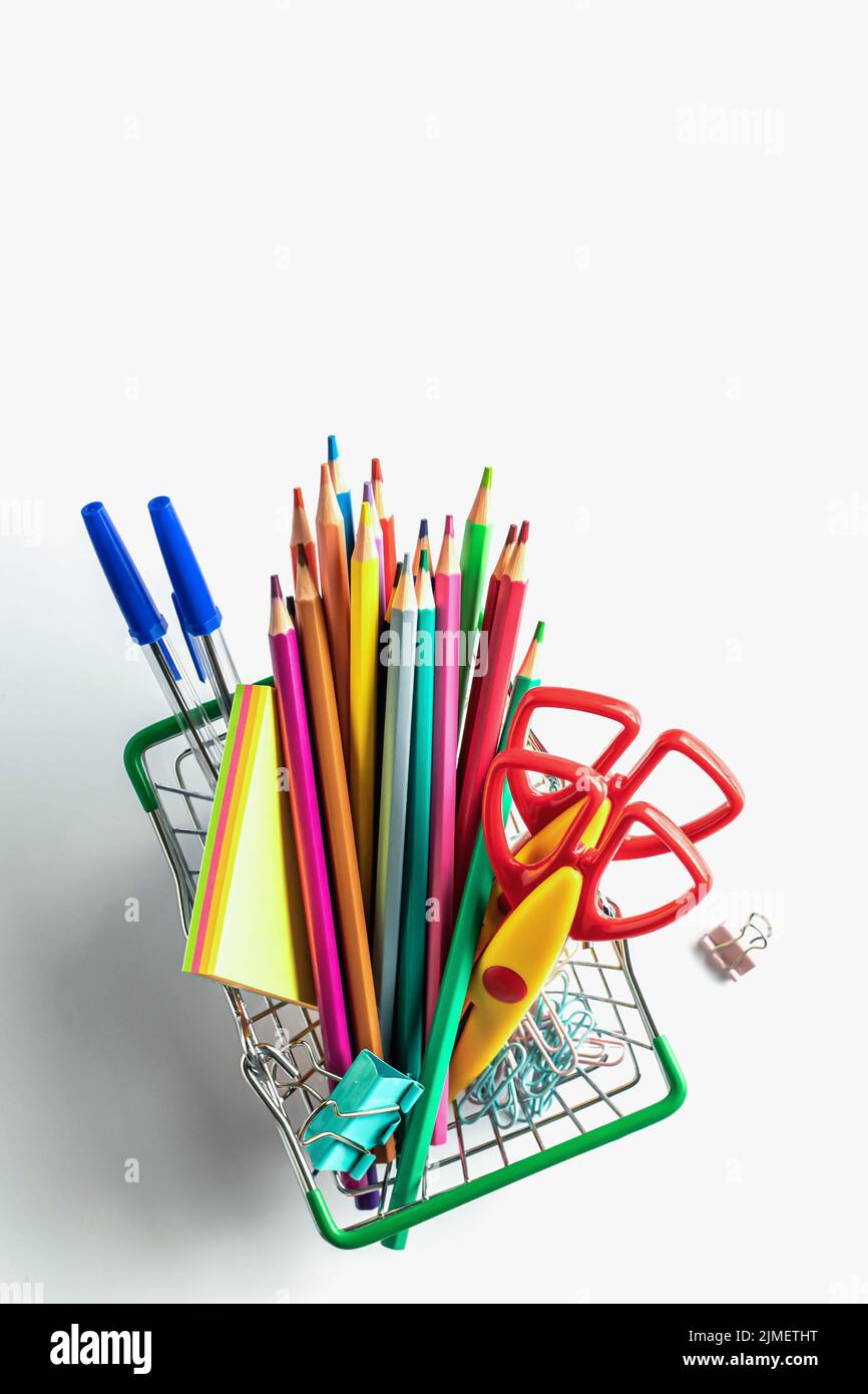 Shopping for school education supplies. Shopping basket with stationery ...