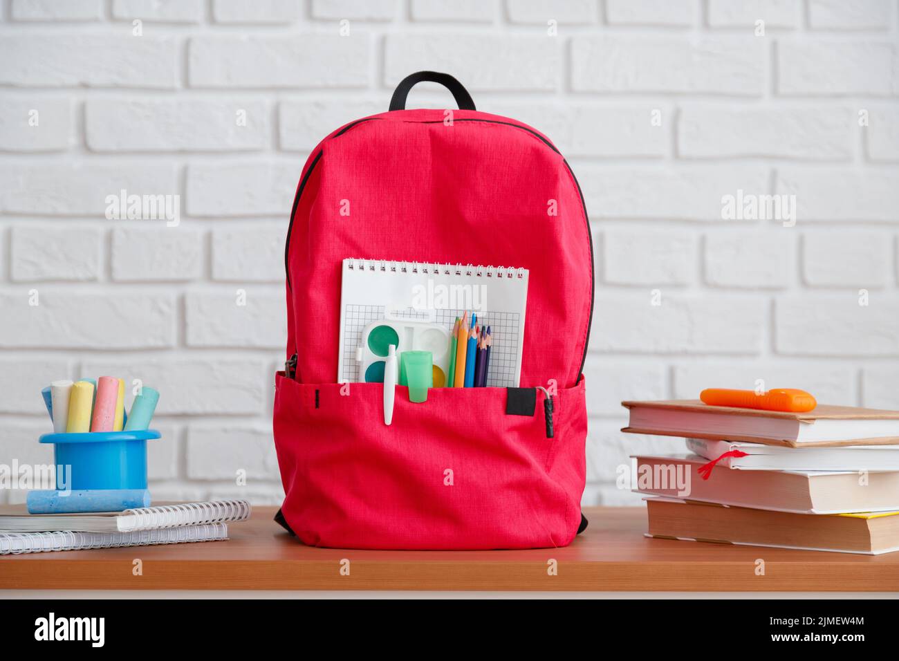 Back to school, backpack with school supplies and stationery, textbooks ...