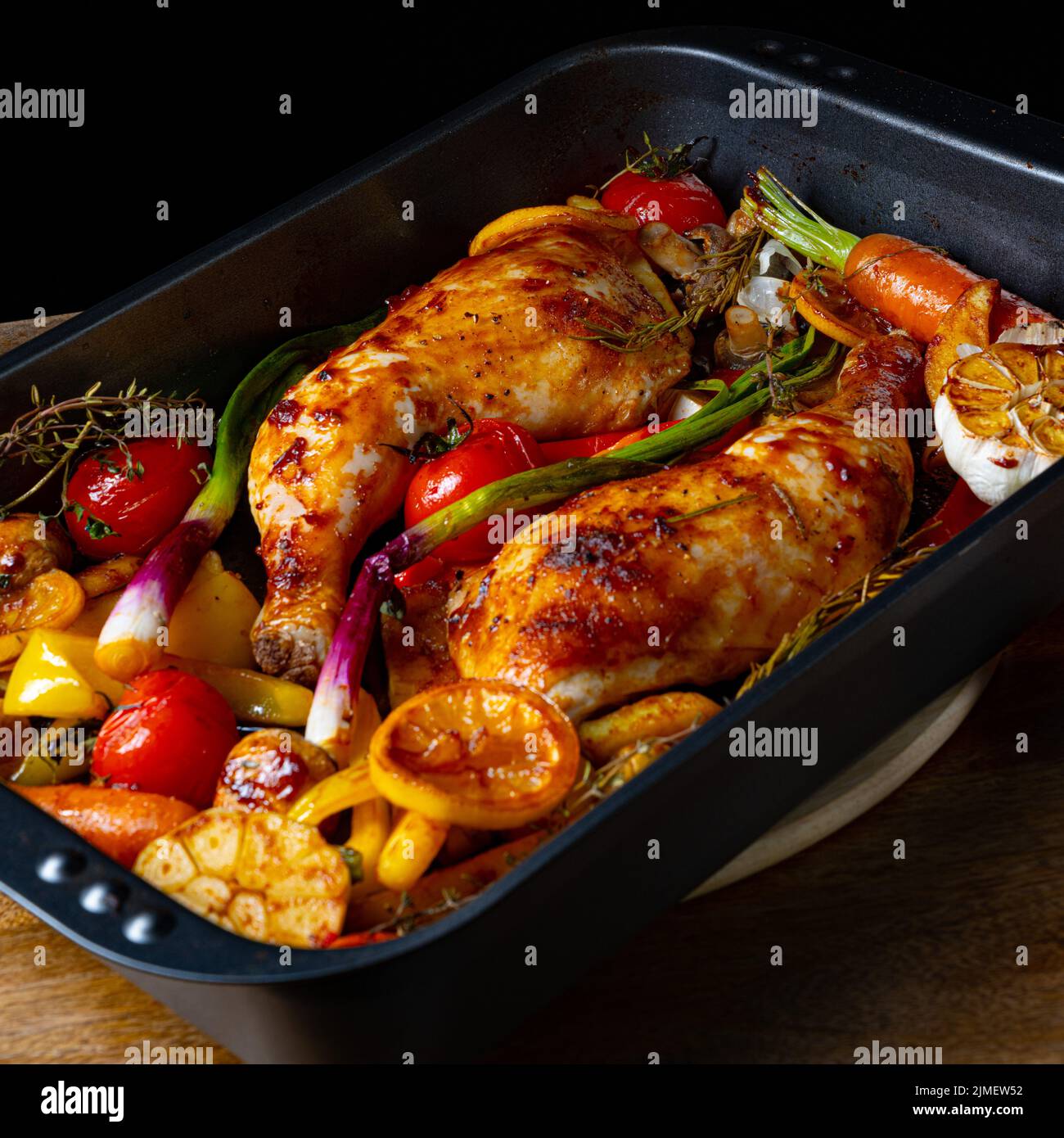 Fried chicken legs with various vegetables Stock Photo - Alamy