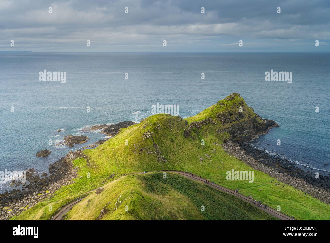 Tourists on the trail, visiting Giants Causeway, Northern Ireland Stock ...