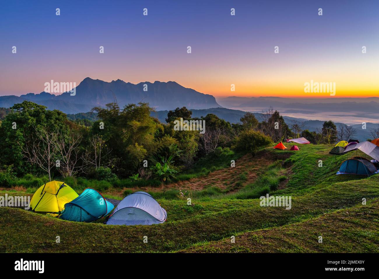 Tropical forest nature landscape view with mountain range sunrise at ...