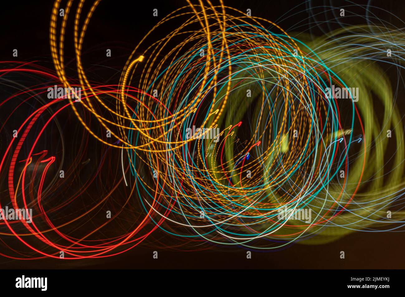 An abstract dynamic effect with colorful bokeh lights in rotating ...