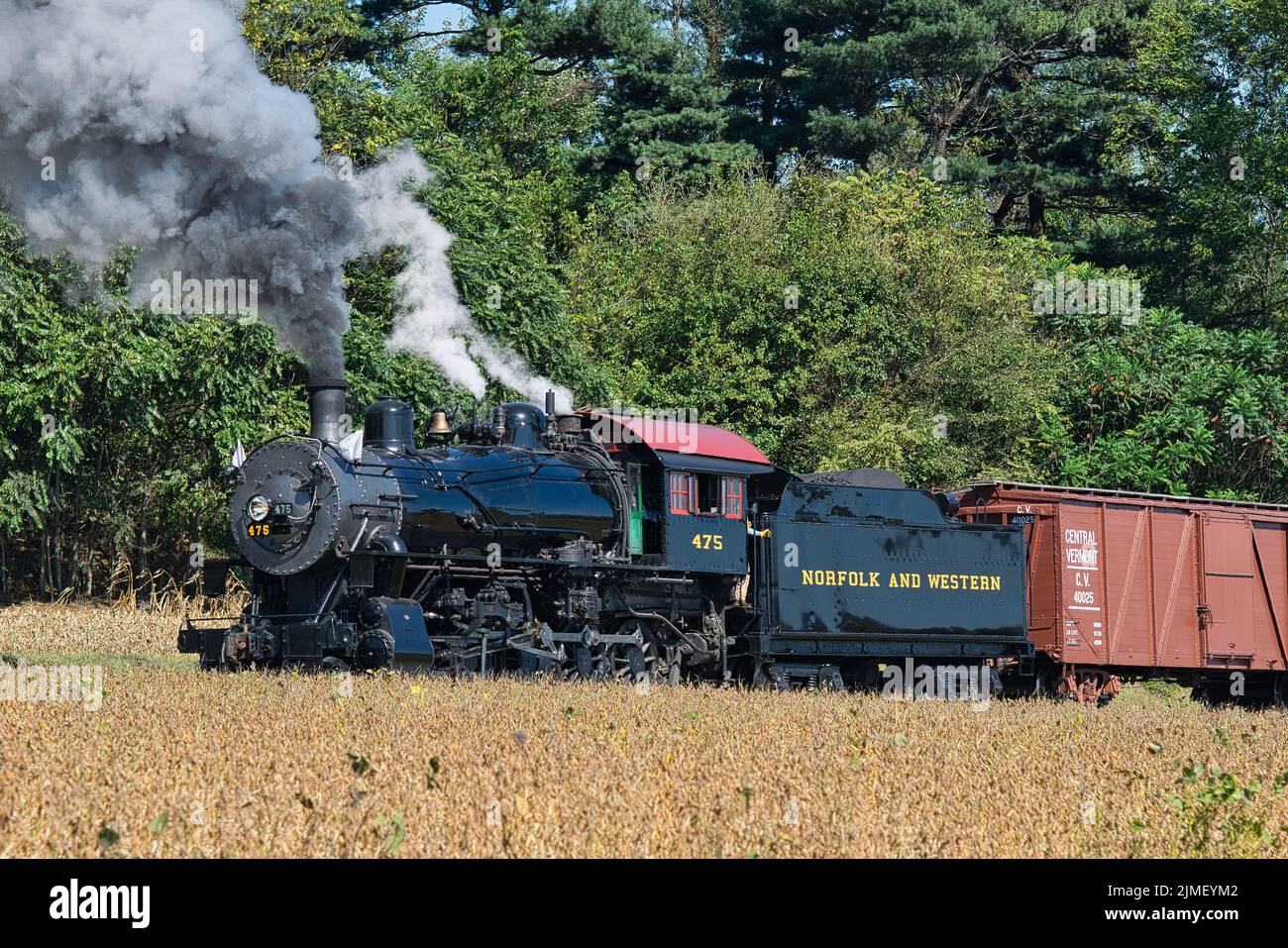 View of an Antique Restored Steam Freight Train Blowing Smoke and Steam ...