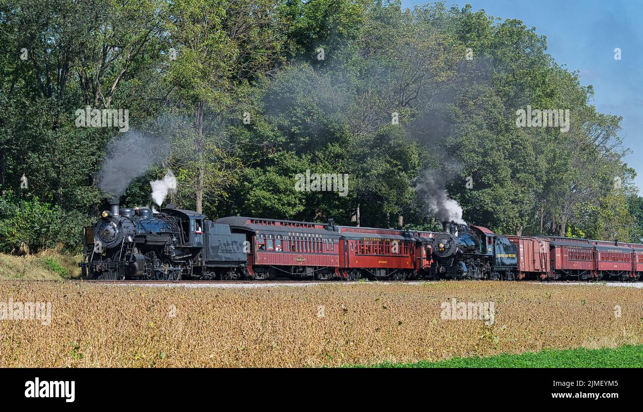 View of Two Antique Restored Steam Passenger Train Blowing Smoke and ...