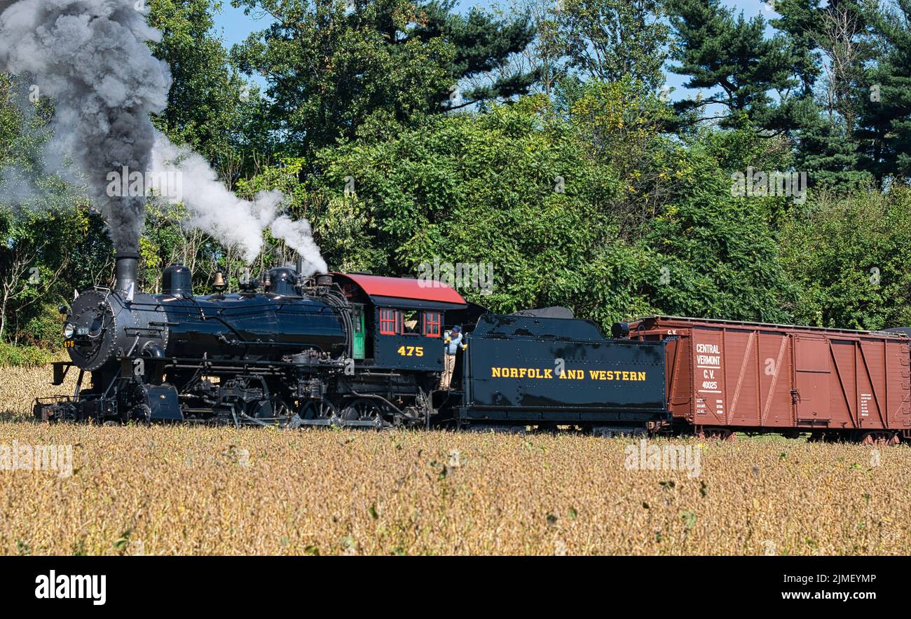 View of an Antique Restored Steam Freight Train Blowing Smoke and Steam ...