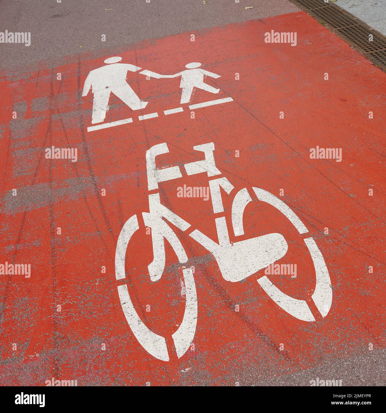 Red marked path for cyclists and pedestrians in the center of Kolobrzeg ...