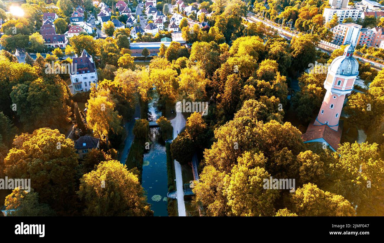An aerial view of the Water Tower surrounded by golden trees and ...