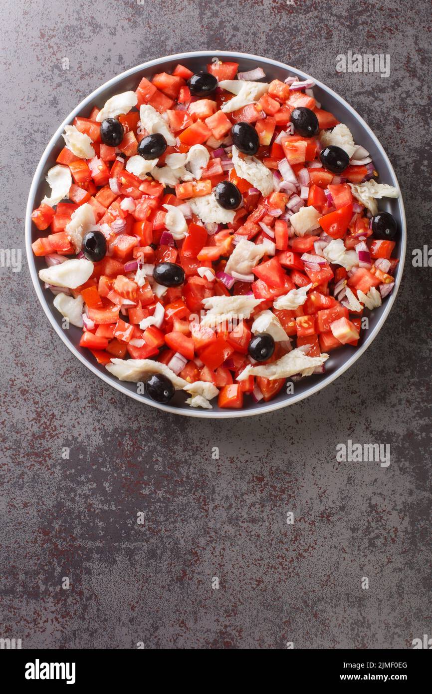 Catalan codfish salad as known as esqueixada, with cod, tomato onion ...