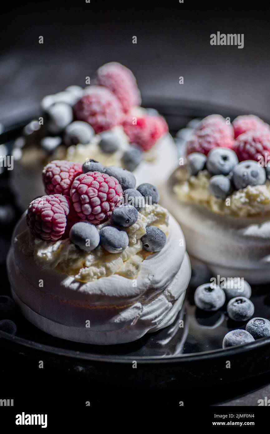 Delicious mini pavlova meringue desserts served with frozen frosty ...