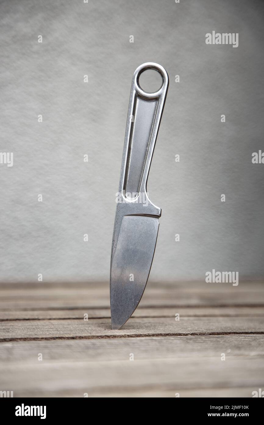 A knife with a metal handle made from a wrench. A tool weapon is stuck ...