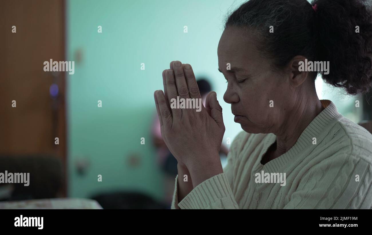 Grateful woman having hope praying hi-res stock photography and images ...