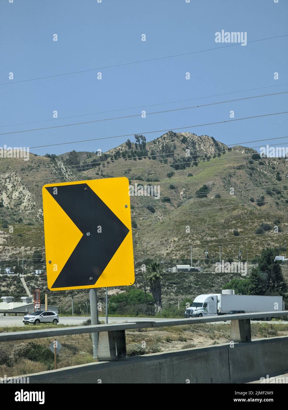 A selective of a curve road sign in the countryside Stock Photo - Alamy