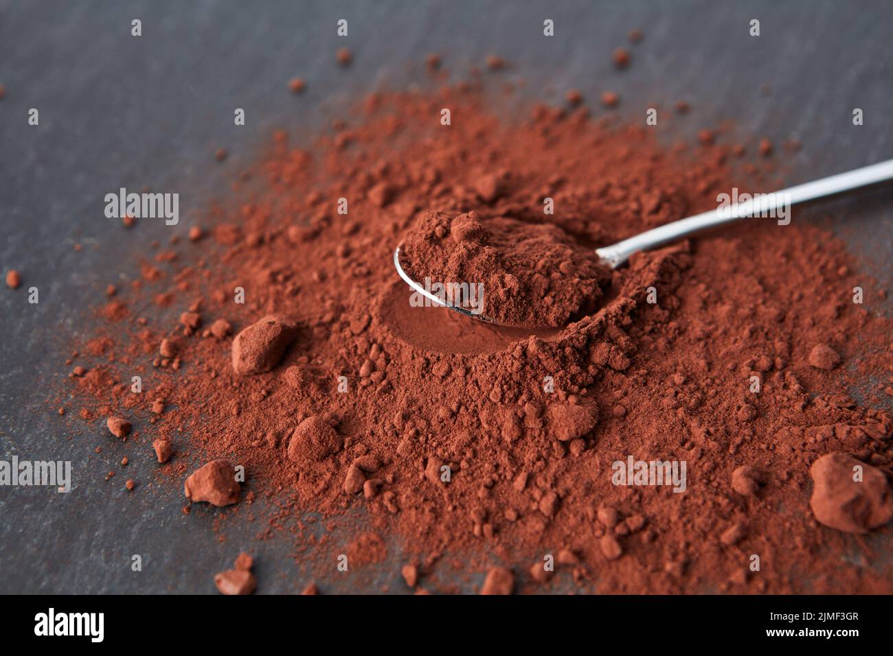 Organic dry cocoa powder pile Stock Photo - Alamy