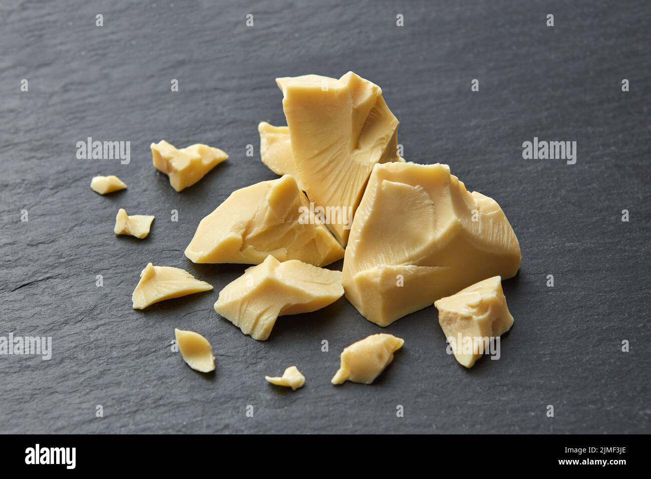 Rough pieces of organic cocoa butter Stock Photo - Alamy