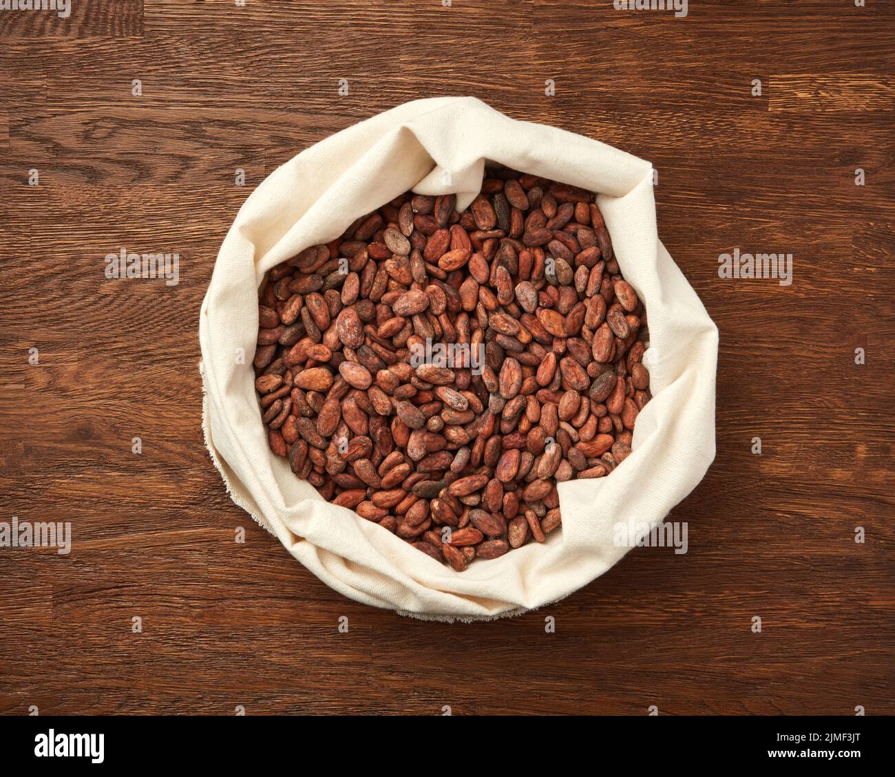 Sack of organic unpeeled cocoa beans Stock Photo - Alamy