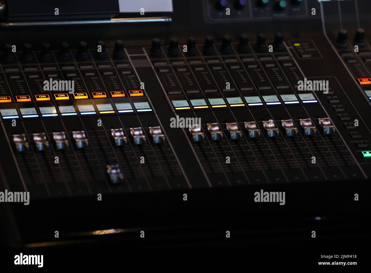 Professional sound and audio mixer control panel with buttons and ...