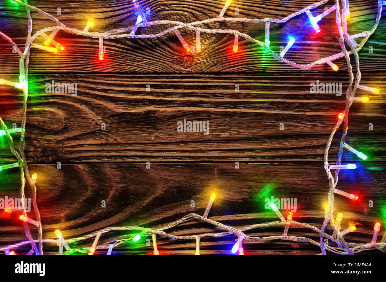 Christmas lights on dark wooden background flat lay mockup frame for ...