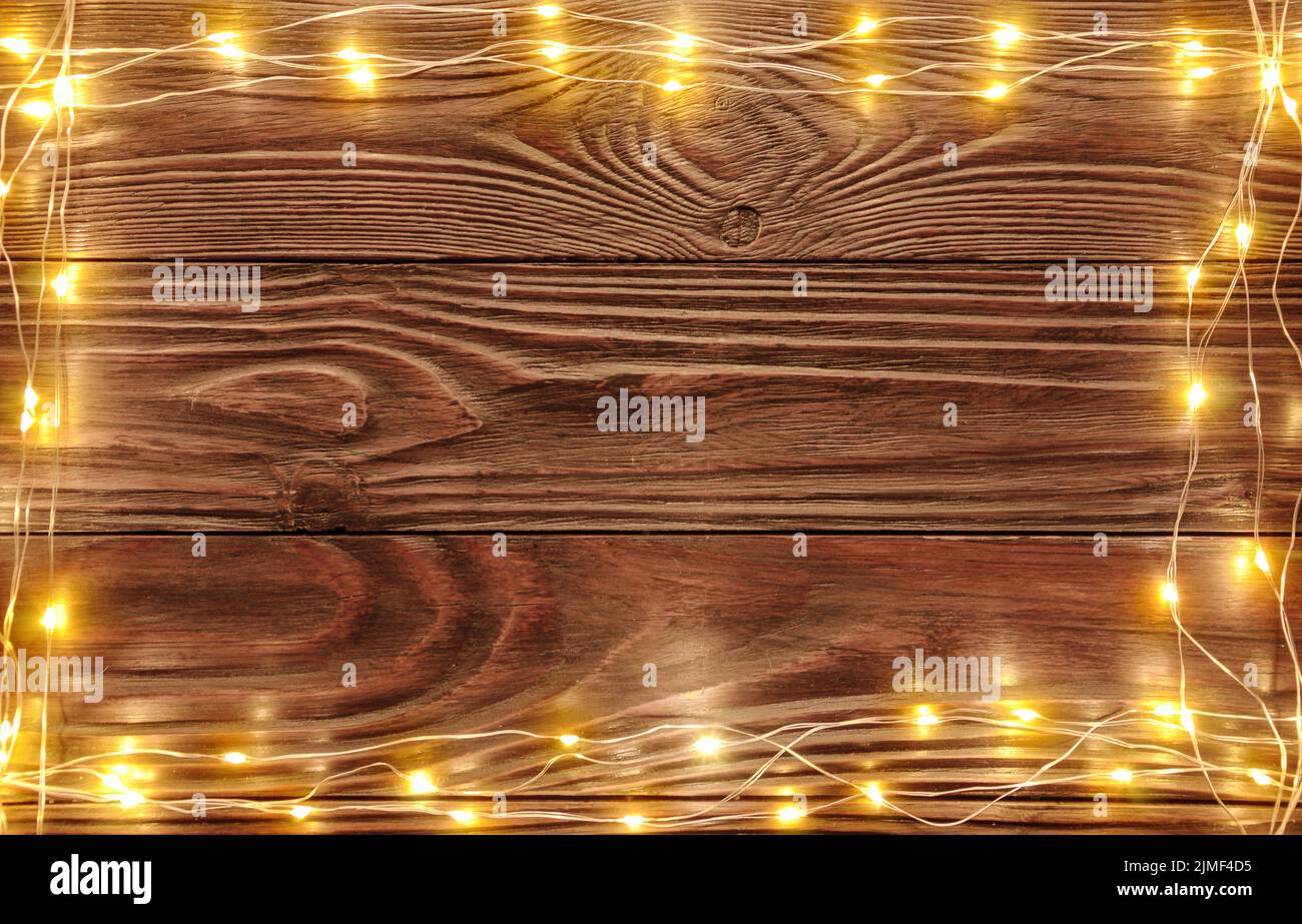 Christmas lights on dark wooden background flat lay mockup frame for ...