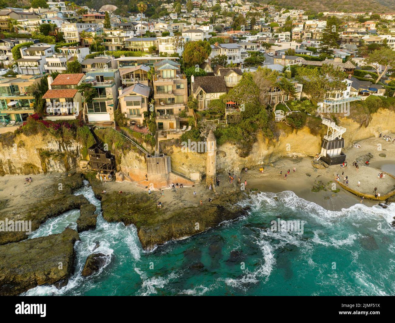 An aerial view of a coastal town with building on the rocks Stock Photo ...