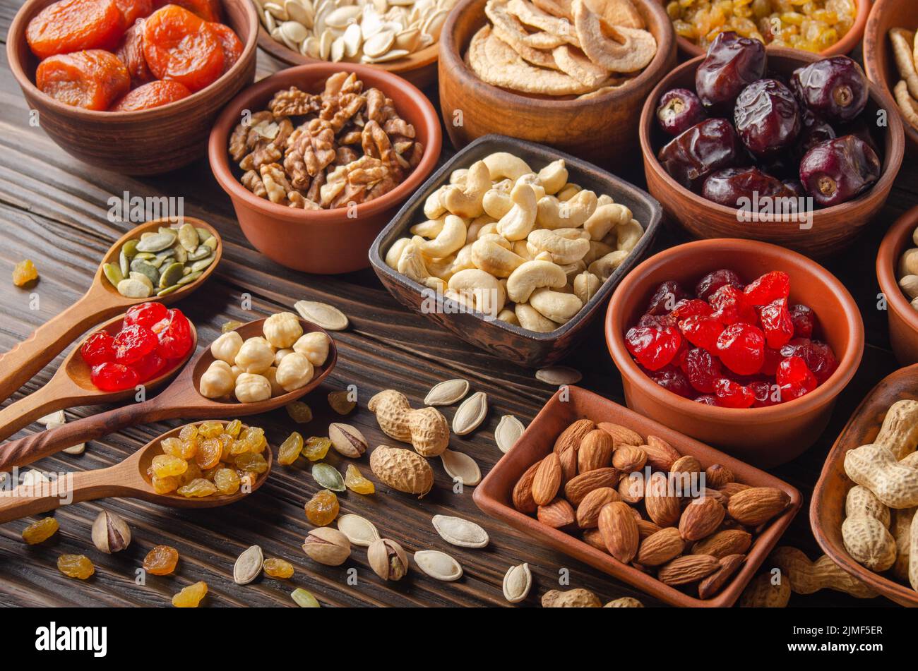 Dry fruits in spoons hi-res stock photography and images - Alamy
