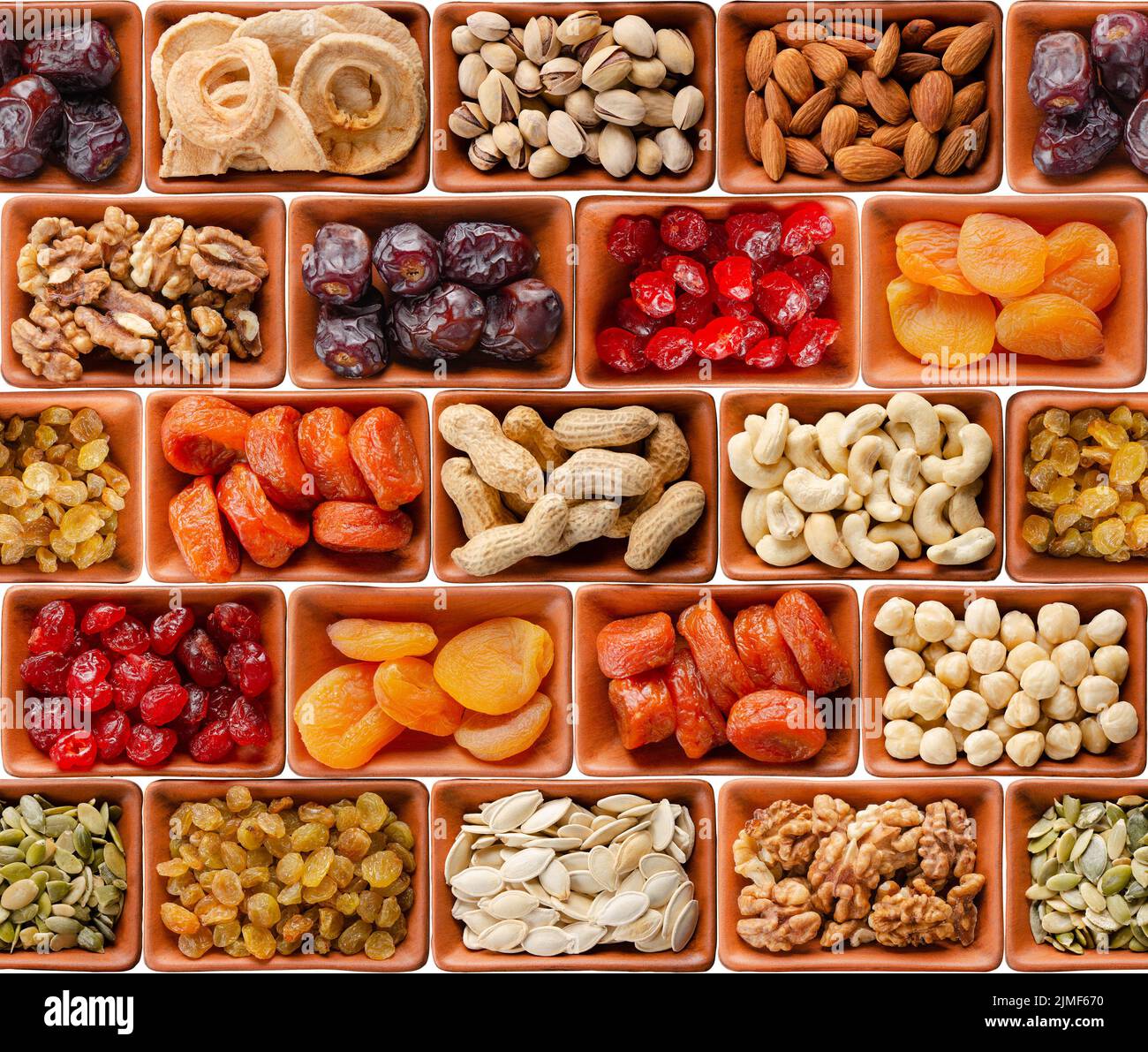 Seamless flat lay food background of dehydrated fruits, seeds and nuts ...