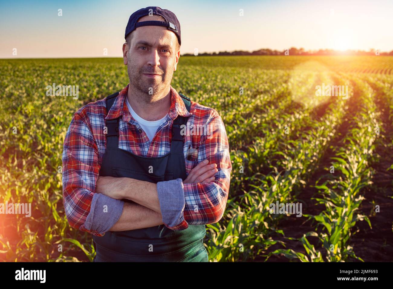 Middle age male caucasian confident satisfied farm worker with crossed ...