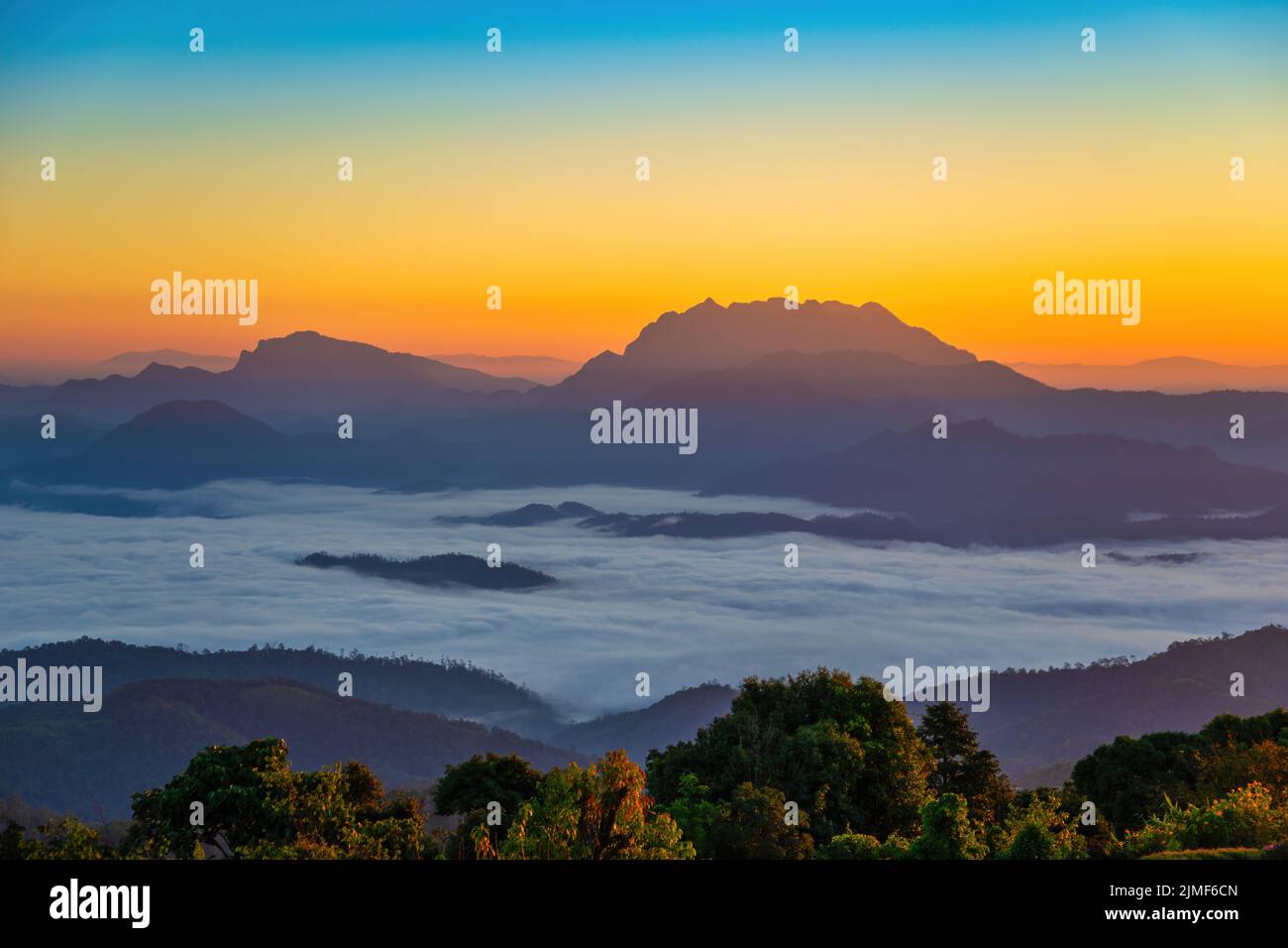 Tropical forest nature landscape view with mountain range sunrise with ...