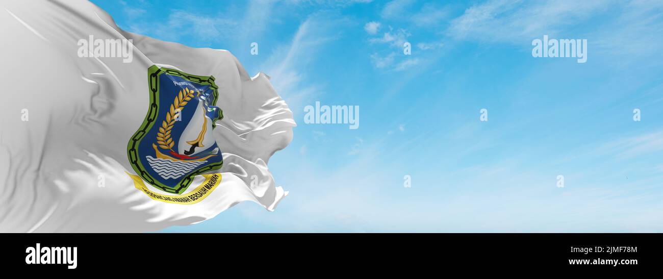 official flag of Riau Islands Indonesia at cloudy sky background on ...