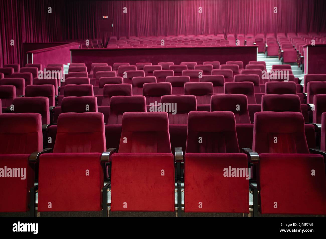 Empty cinema hall with red seats. Movie theatre Stock Photo - Alamy