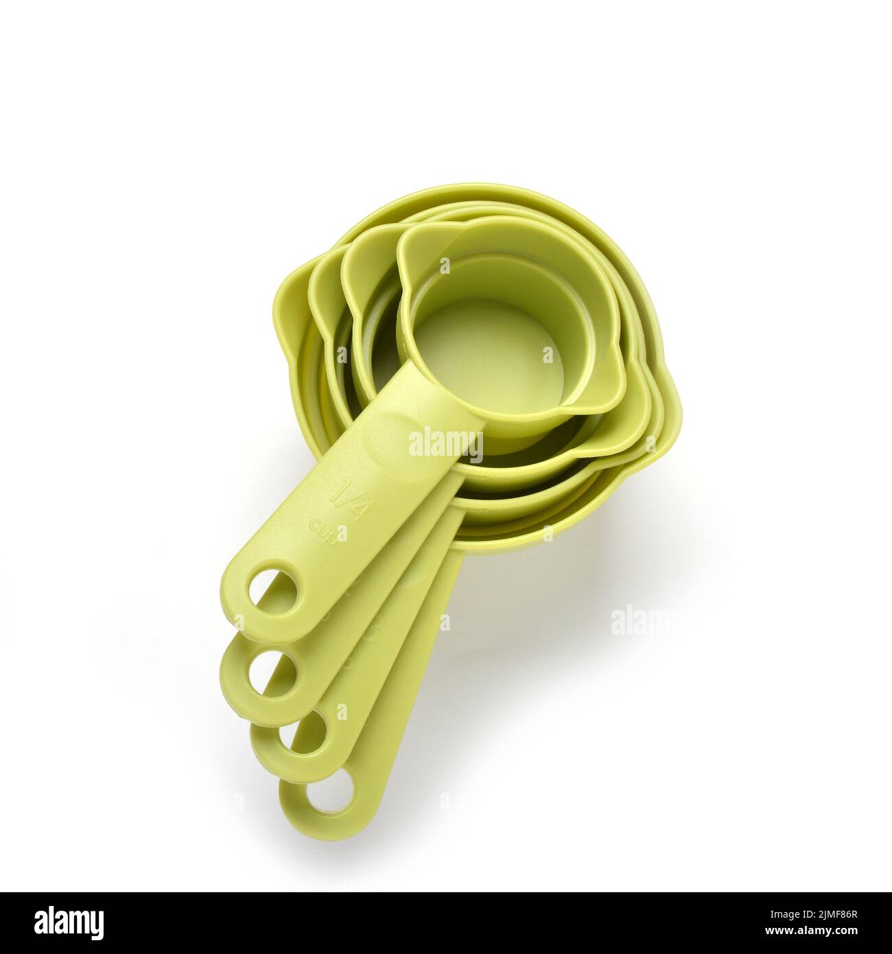 Set of green plastic cup measurement cups used in baking or cooking ...