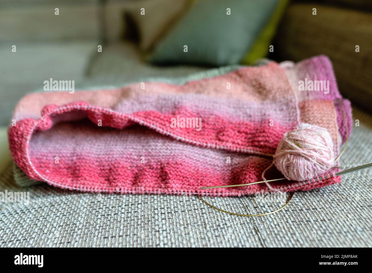 Knitted clothing, accessory in the process of creation. Knitting ...