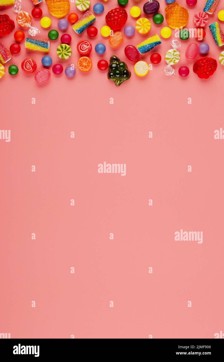 Flat lay view at sweet background of different type color and taste ...