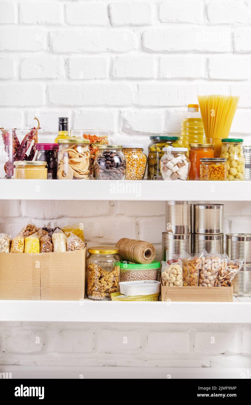 Set of long storage term foods on pantry shelf prepared for disaster ...