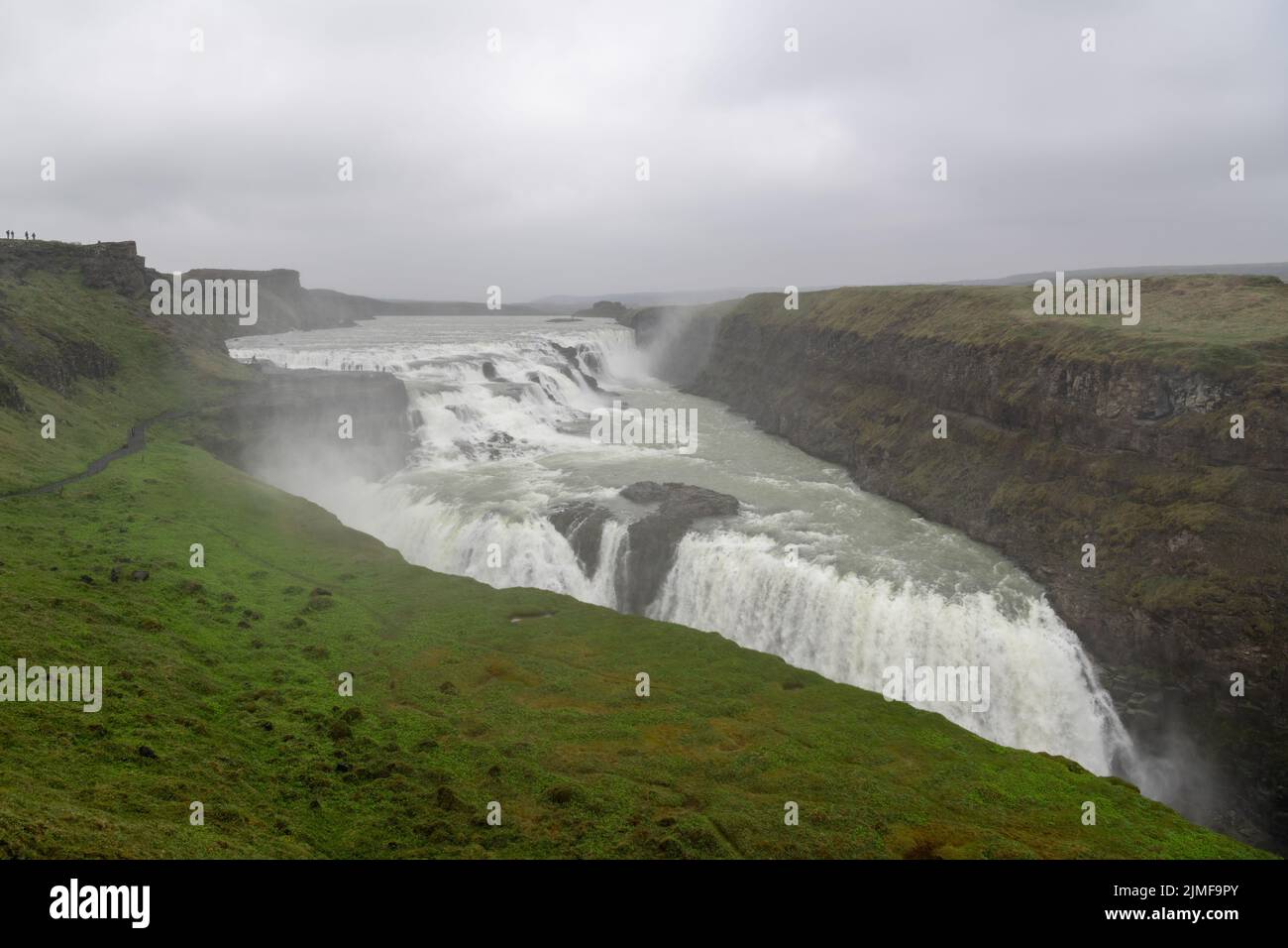 A view of the waterfall and hills Stock Photo - Alamy