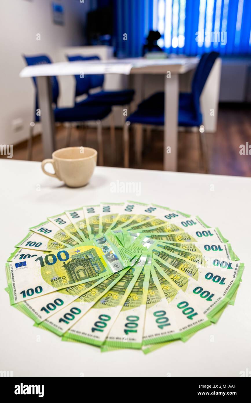 Euro cash. 100 hundred banknotes on white table. paper money Stock ...