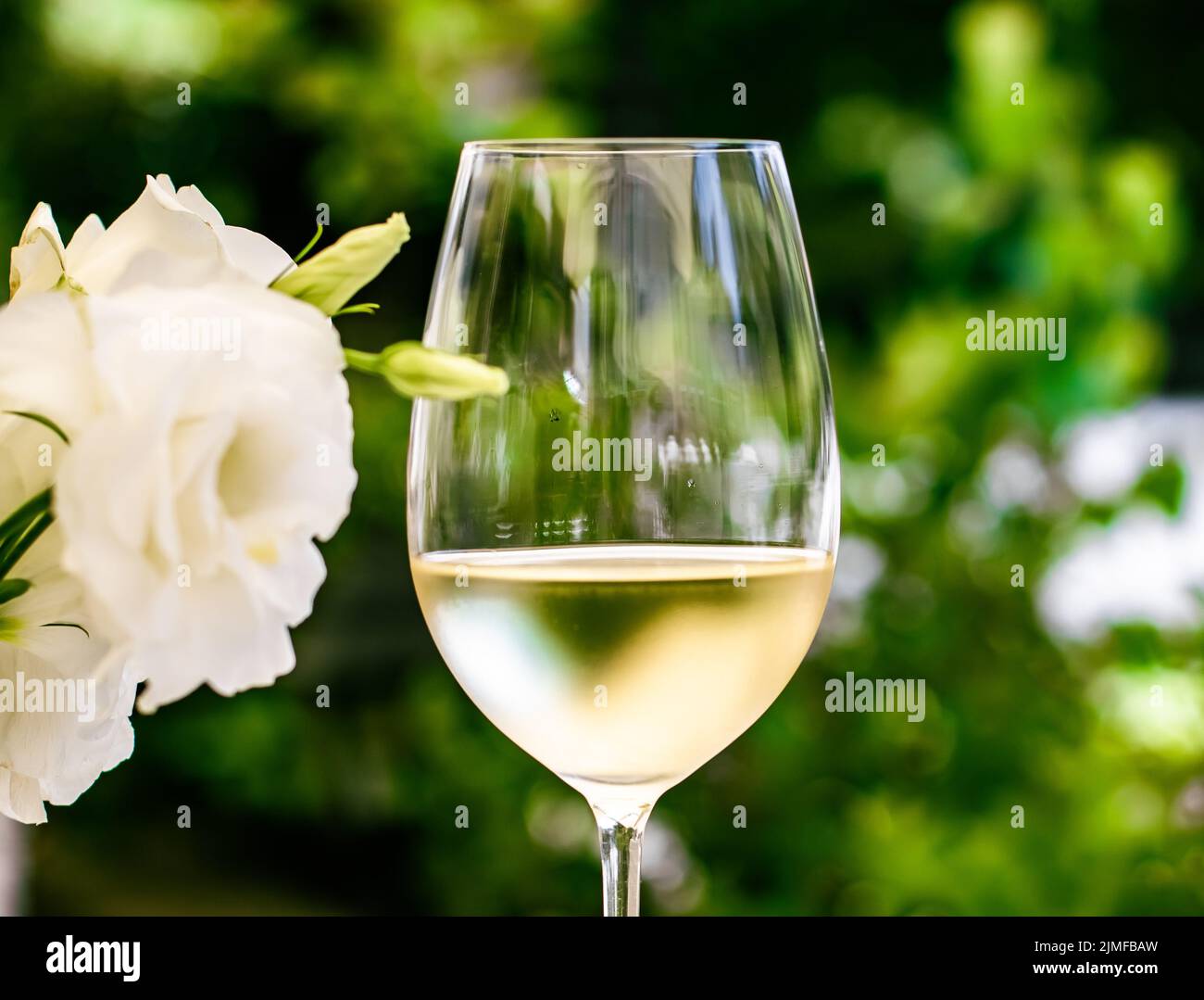 White wine in luxury restaurant on summer garden terrace, wine tasting ...