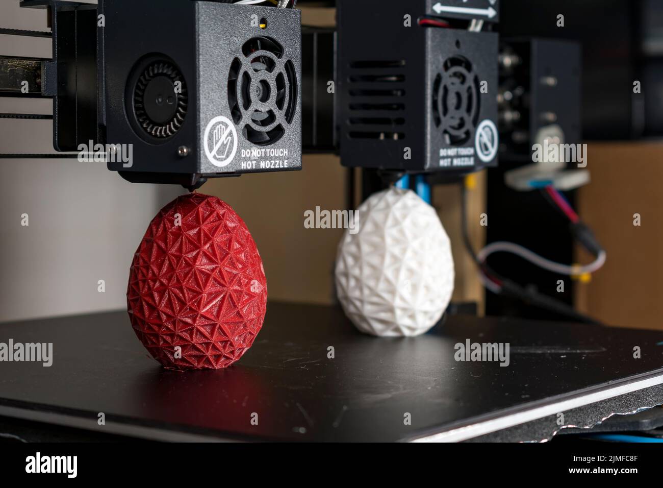 Dual extruder 3d printer which finished printing two bicolor egg model ...