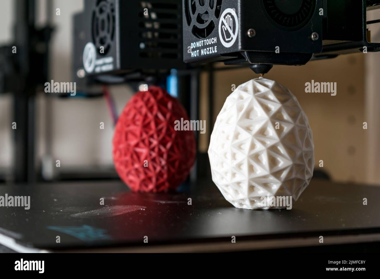 Dual extruder 3d printer which finished printing two bicolor egg model ...