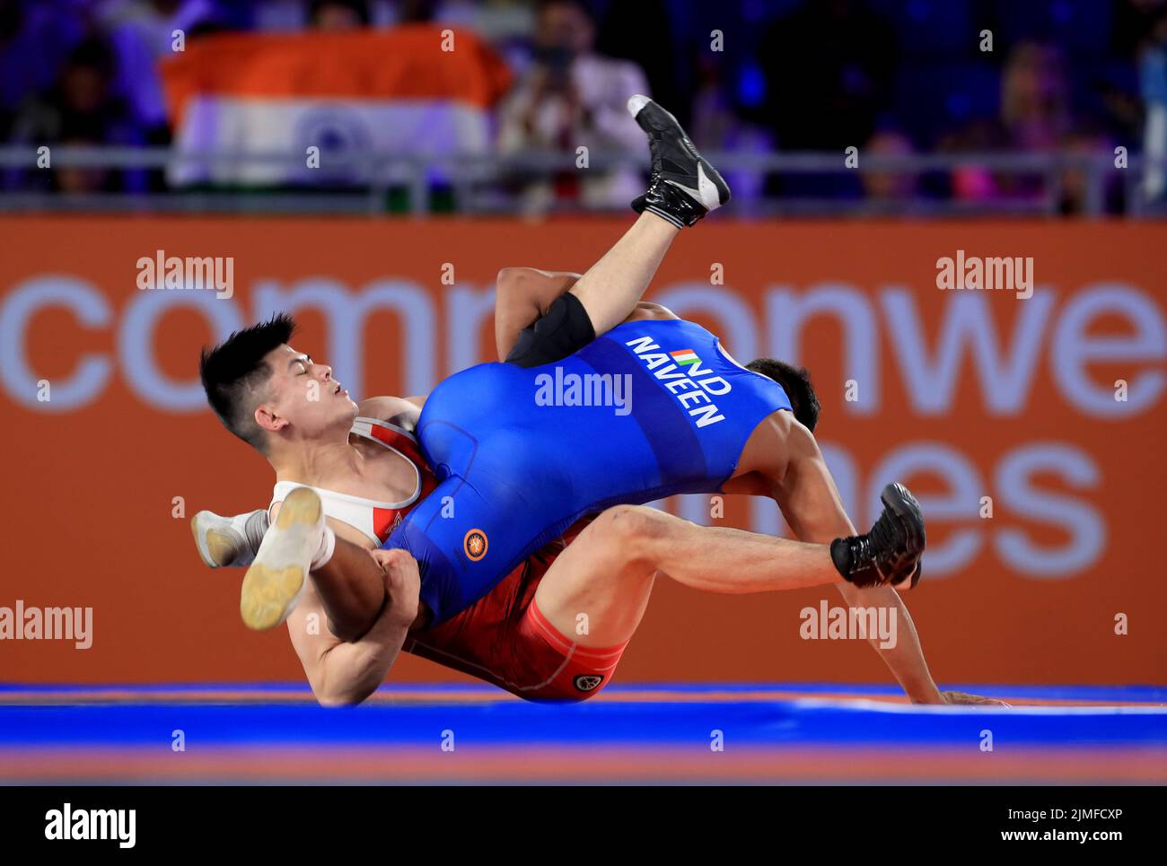 India’s Naveen Naveen competes against Singapore’s Hong Yeow Lou in the ...
