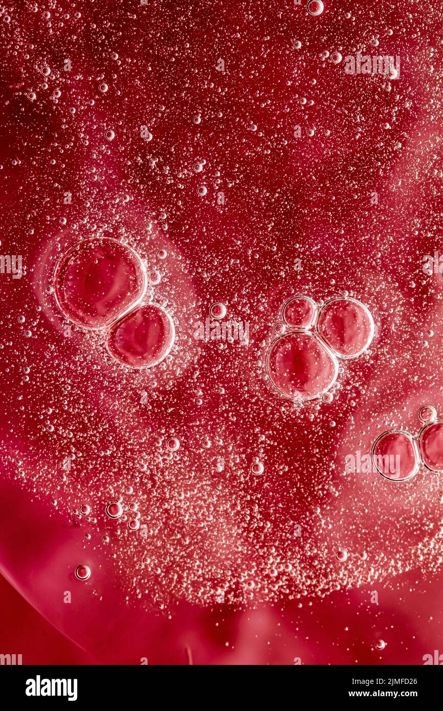 Abstract red liquid background, paint splash, swirl pattern and water ...